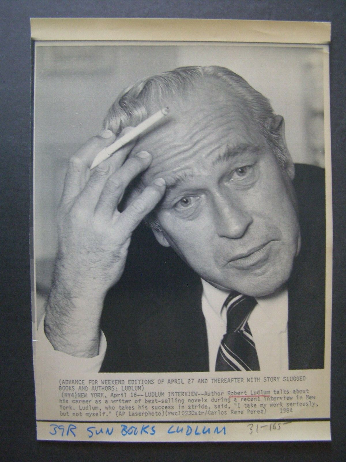 AP Wire Press Photo 1984 Author Robert Ludlums Takes his his Work ...