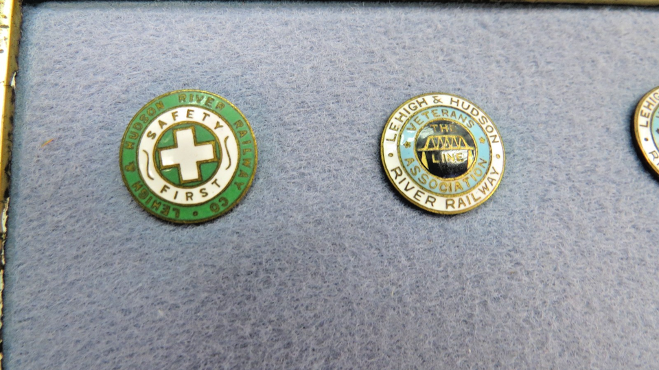 FRAMED MOUNTED COLLECTION OF ANTIQUE RAILROAD TAC PINS, 20 RAILWAY PINS ...