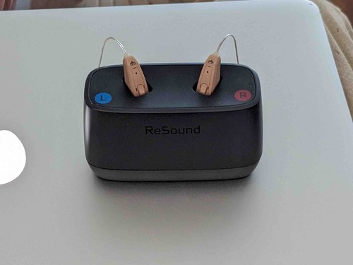 2 new Resound key 4 Rechargeable Hearing Aids. With charger insertion ...