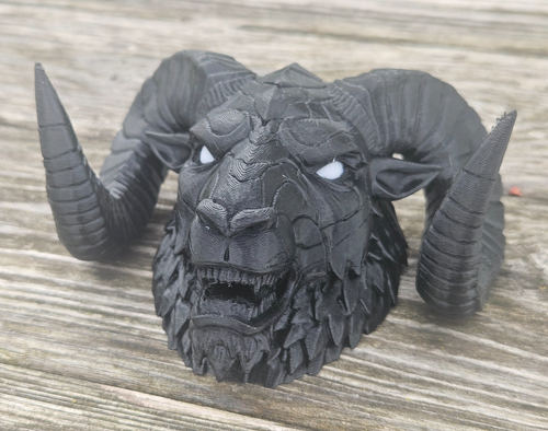 Head of a RAM monster with white eyes emblem logo of a black demon ...