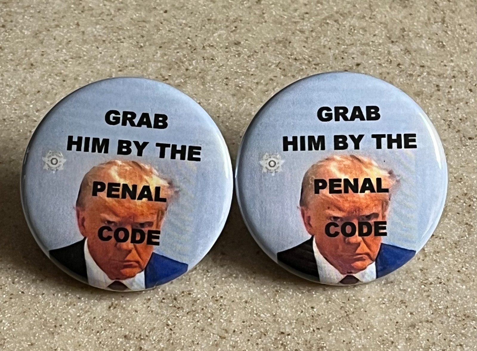 Anti-Trump Pin-Back Buttons 2-Pack. Grab Him By The Penal Code. 1 1/2 ...