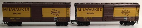 Two MDC MIlwaukee Road Rib-Side Yellow-Stripe Boxcars, HO Scale w ...