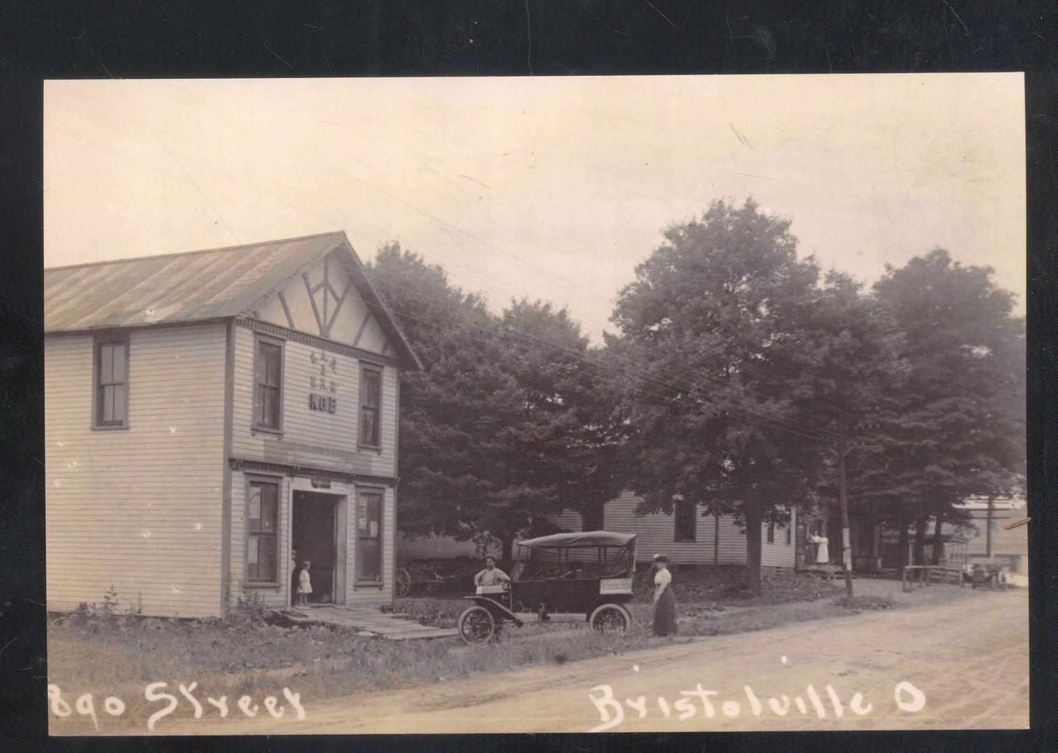 REAL PHOTO BRISTOLVILLE OHIO DOWNTOWN GAR STORE OLD CAR POSTCARD COPY ...