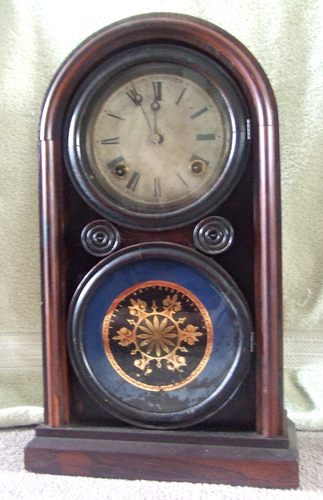 An old INGRAHAM round top clock. It is in very condition = runs X well ...