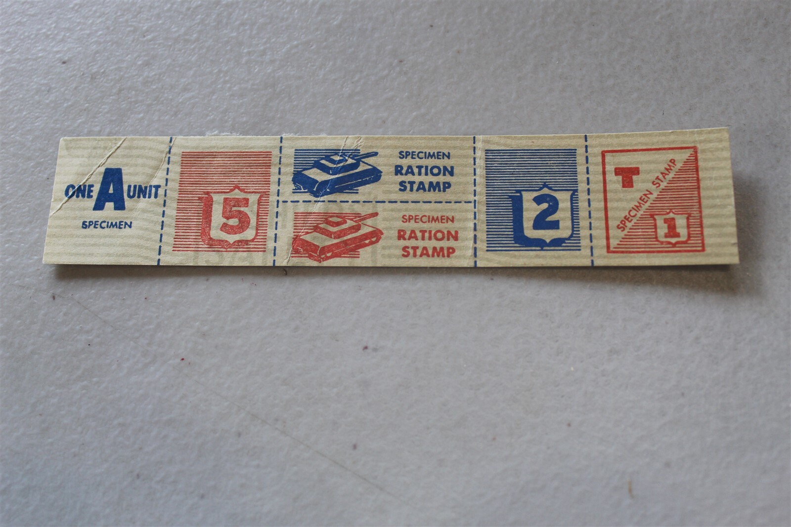US WWII OPA RATION - SPECIMEN STAMP STRIP. A UNIT, T1, 2,5 AND TANK IN ...