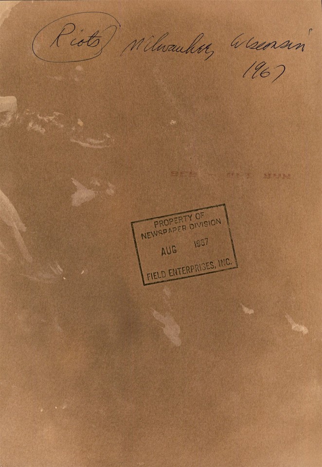 LG2 1967 Wire Photo IT'S A BIT LARGE MILWAUKEE BOY TRIES ON POLICE RIOT ...