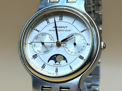 Vintage CASIO ARGENT MTW-150 Moon Ivory Roman Day-Date 33mm QZ Watch ...