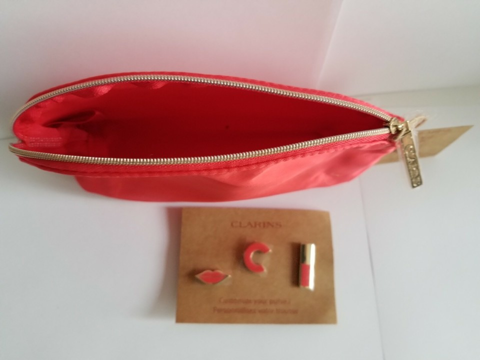 CLARINS PINK COSMETIC TRAVEL BAG WITH CLARINS LOGO PINS . BUY 1,2 OR 3 ...
