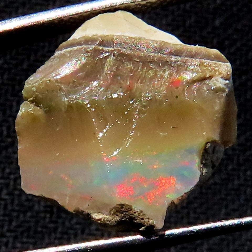 NATURAL PLAY OF COLOR ETHIOPIAN OPAL ROUGH GEMSTONE 8.40 Cts. (15x16x09 ...