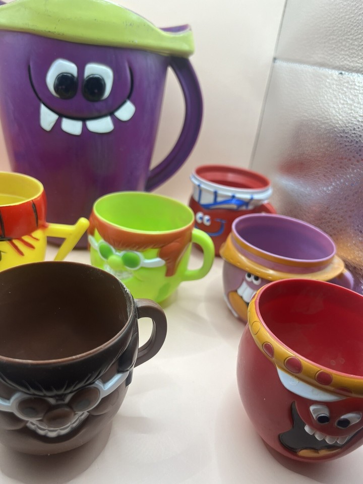 Pillsbury FUNNY FACE Set NINE MUGS & GOOFY GRAPE Pitcher W/ CHUG A LUG ...