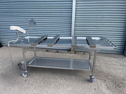 Nearly new stainless steel mortuary embalming/preparation table made by ...