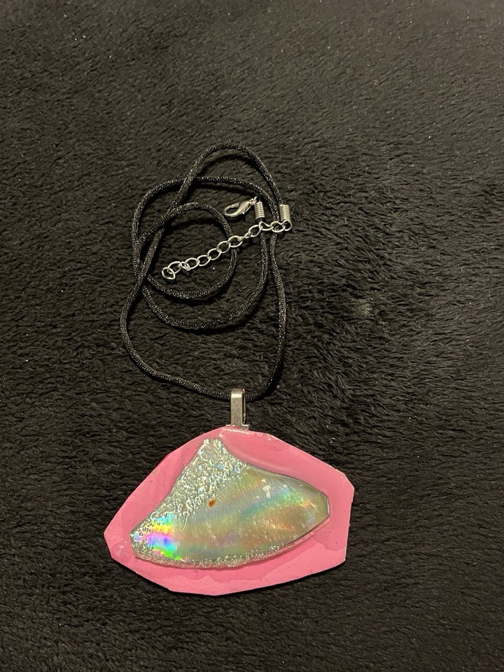 Elegant pink pendant necklace with a black cord. Perfect for any ...