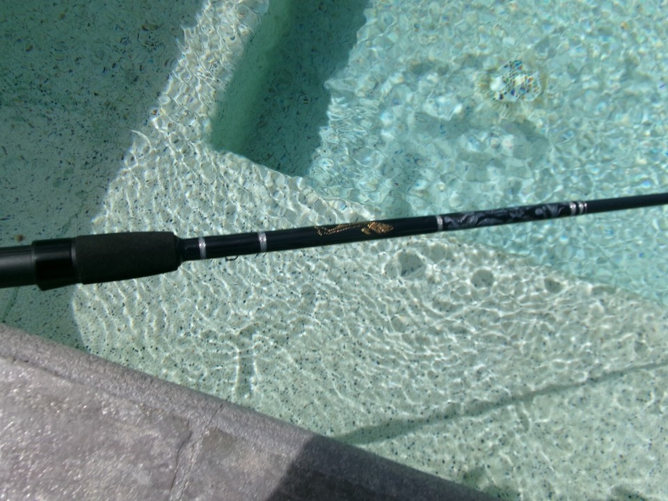 New, custom built, 7'2" 10-20 lb. spinning rod w/hand woven Snook image ...