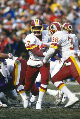 Doug Williams Washington Redskins hands off to George Rogers Football ...