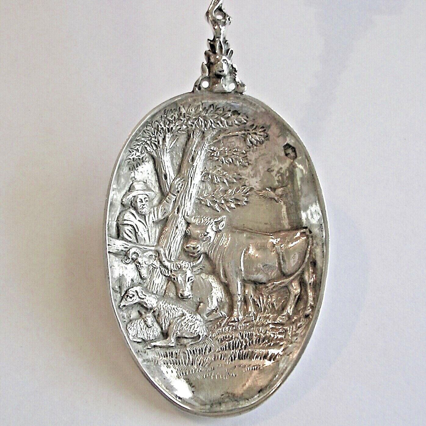 Antique Dutch silver serving spoon, large w/storks cow sheep goat ...