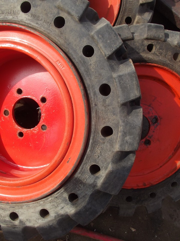 5.70-12 solid tires and rims (4) bobcat 371 310 440b rounder L600 skid ...