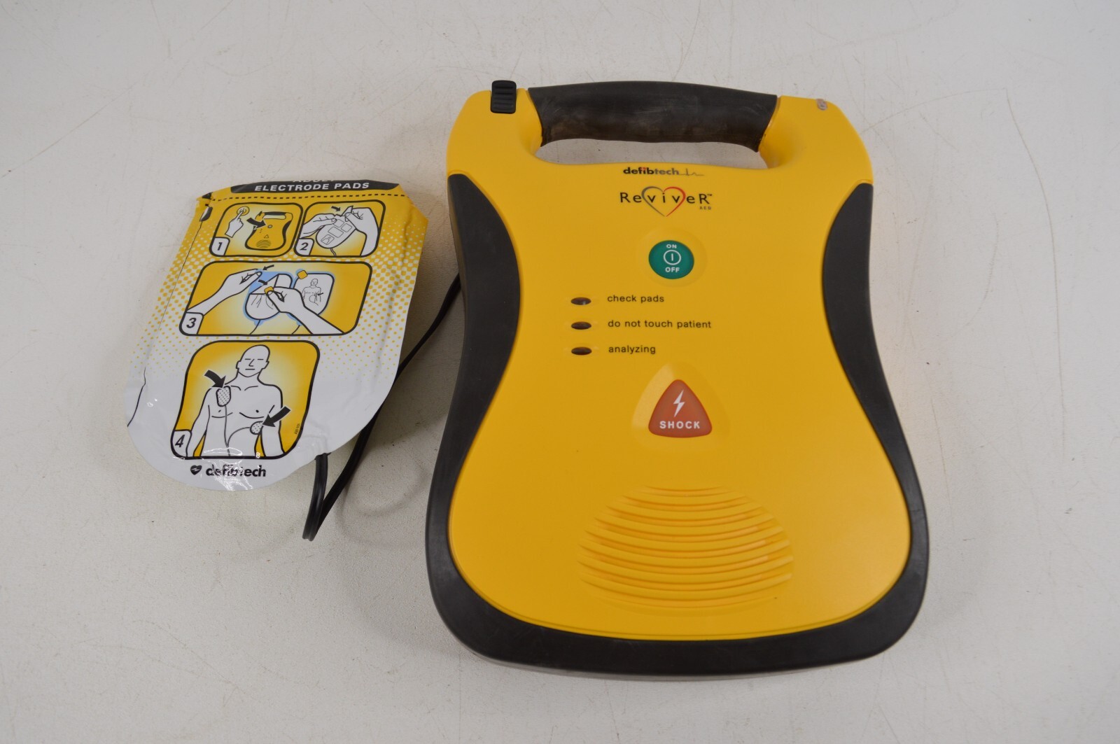 Defibtech Reviver Lifeline AED System w/ Chest Pads in Metal Storage ...