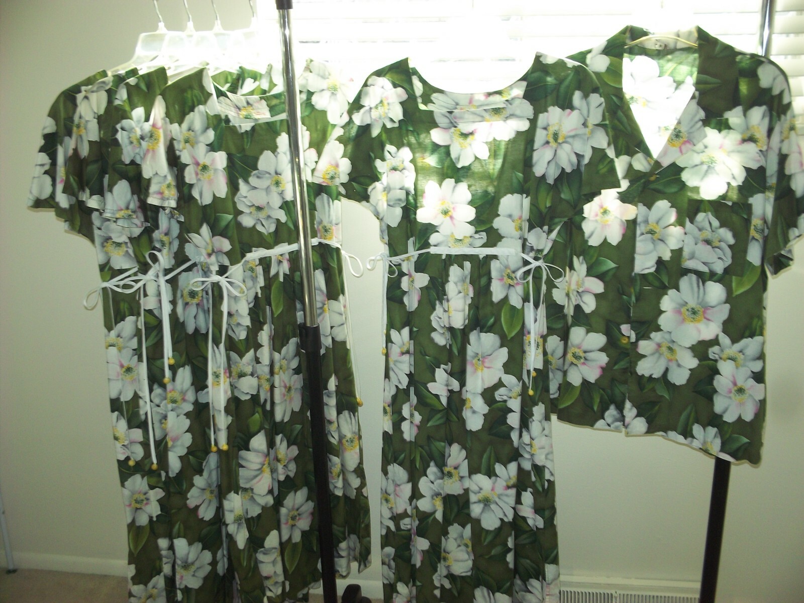 Five matching Hawaiian muu muus and matching men’s sh… - Gem