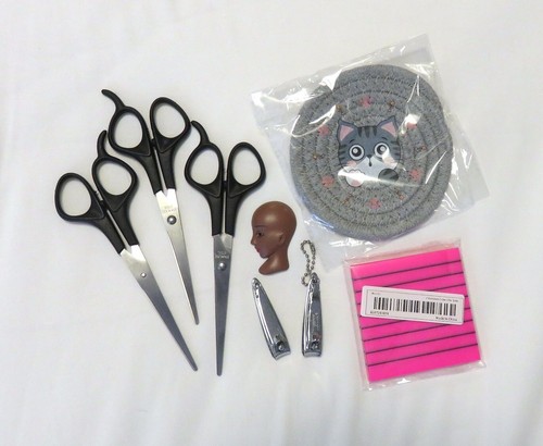 Ladies junk drawer of mostly new items, scissors, nail clippers ...