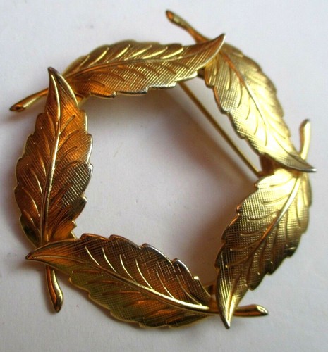 Belle broche couleur or feuilles palmes entremêlées en rosace bijou ...