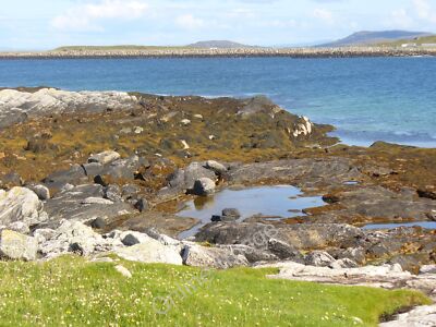 Photo 6x4 Cracanais, Berneray Port nan Long Rocky foreshore on Berneray ...