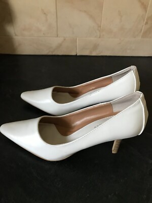 BrandNew White Pumps w/ small scratch underneath one of the pumps size ...