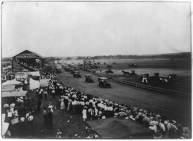 Auto parade, Pratt County Fair, Pratt, Kansas. Cars going around track ...