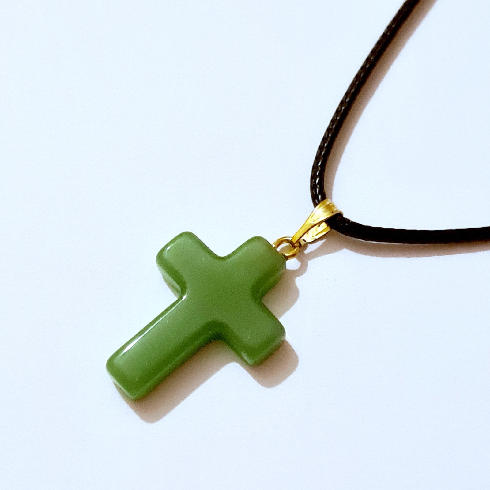 Dark Green Crystal Cut Glass Cross On A Black Lace Cord | eBay UK