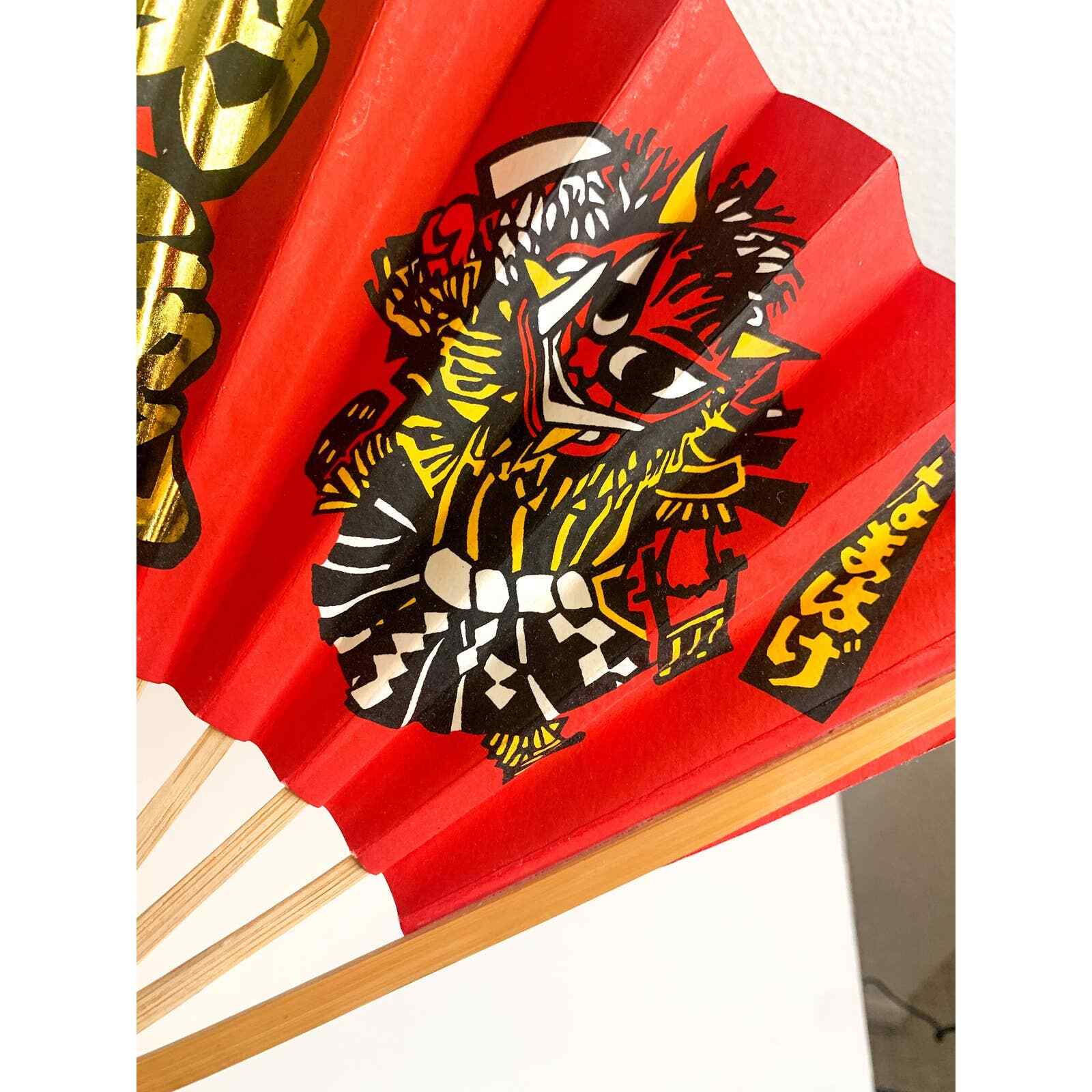 Vintage red Japanese dance fan with traditional imagery and bamboo ...