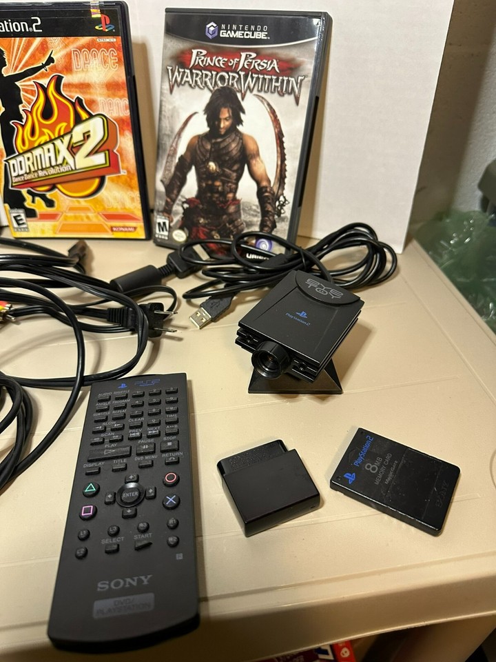 Playstation 2 System, 3 games, 2 Controllers, DVD remote, Camera Used ...