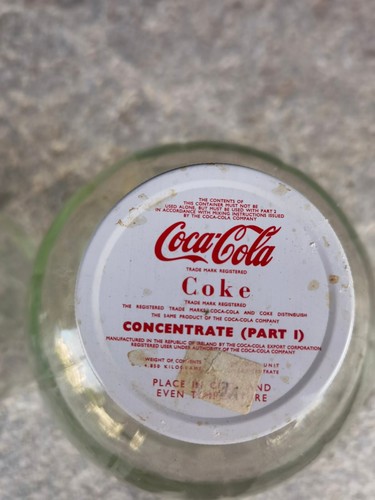 Four large bottles of Coca Cola, collectible Coca Cola concentrate ...