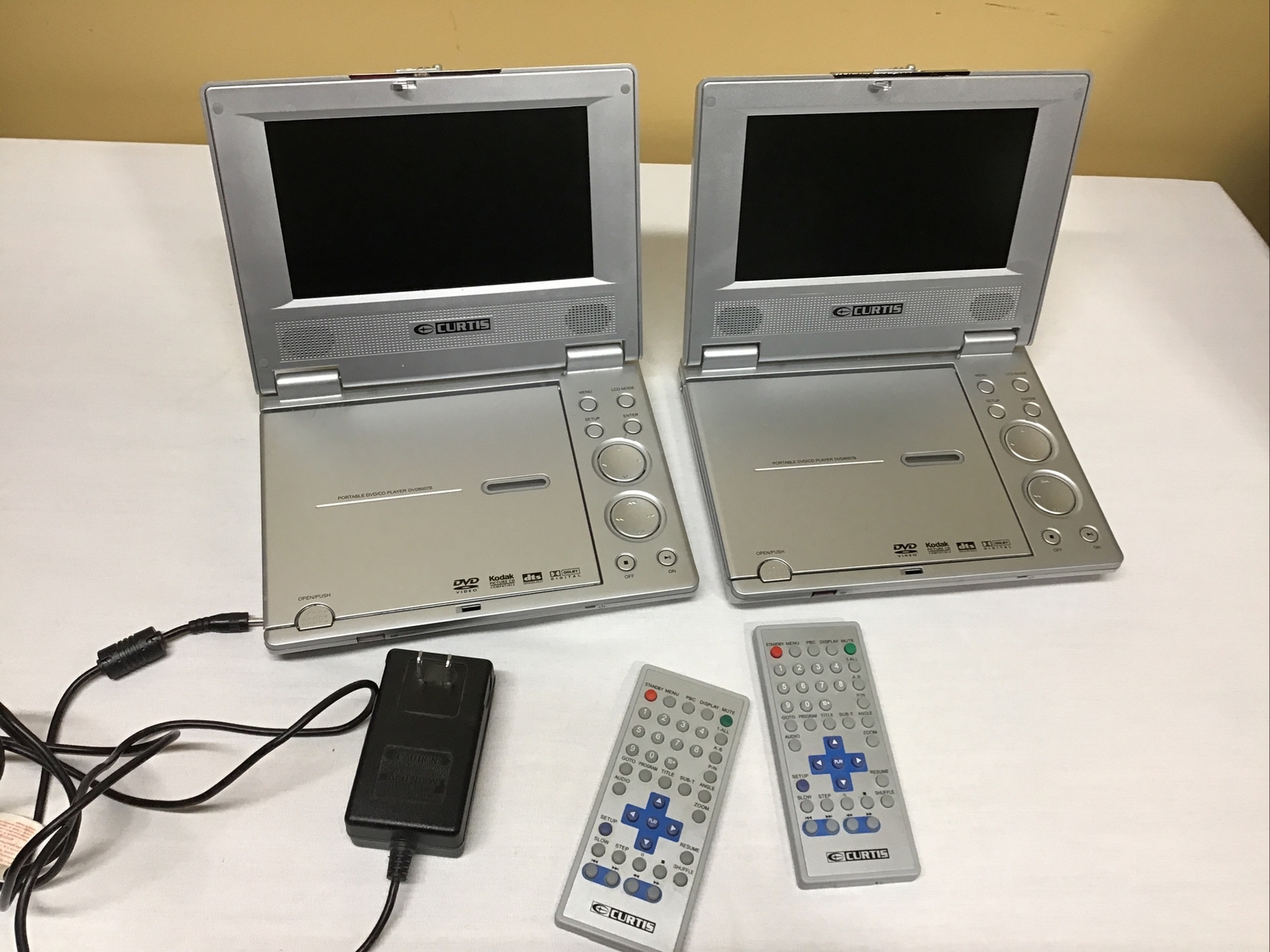2 Curtis Portable Dvd/cd Players (DVD8007B) 2 Remotes 1 Adapter Nice ...