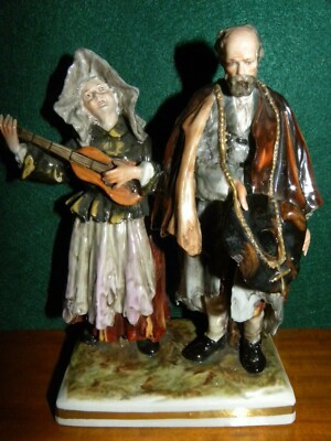 A GERMAN ALBERT STAHL PORCELAIN FIGURINE DEPICTING A LADY BUSKER ...
