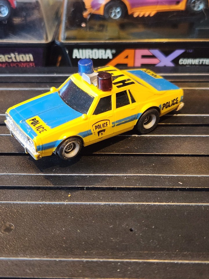 AFX YELLOW & BLUE POLICE HO SLOT CAR MAGNATRACTION | eBay