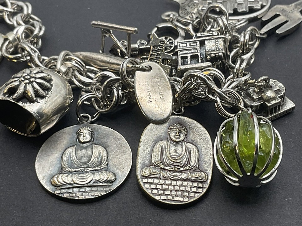 Vintage Charm Bracelet with 11 Charms One of the charms is a Rare Gra ...