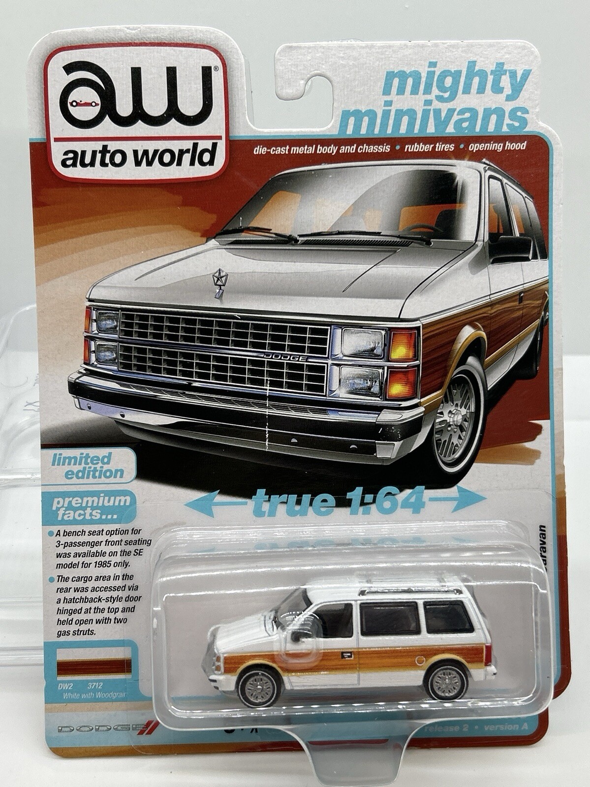 Auto World 1:64 scale 1985 Dodge Caravan MiniVan white w/woodgrain rel ...