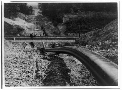 The Big Inch pipeline under construction,pipe going under railroad,up ...