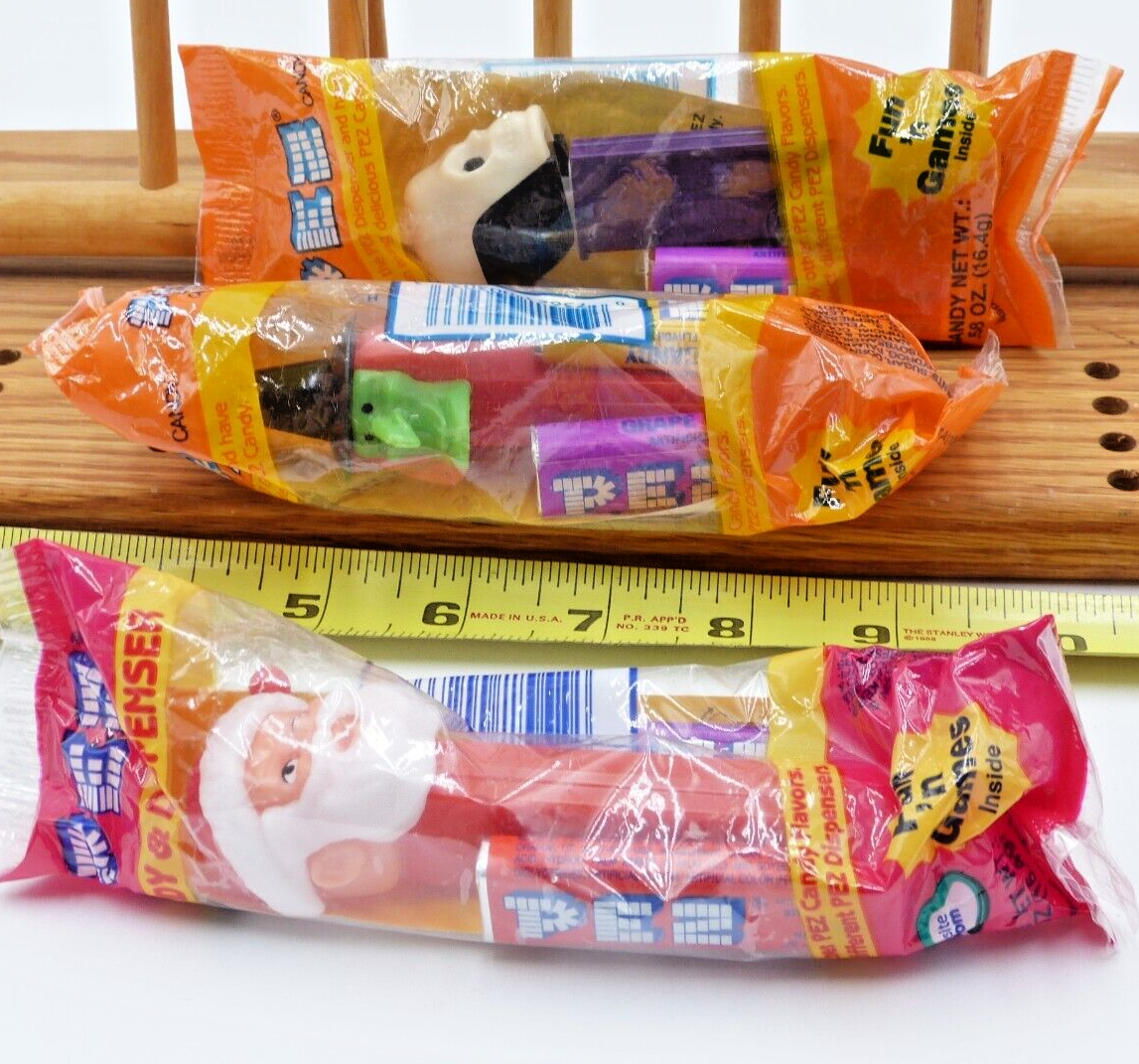 PEZ Witch w/green face & Skull w/purple base + Santa Claus. New in ...