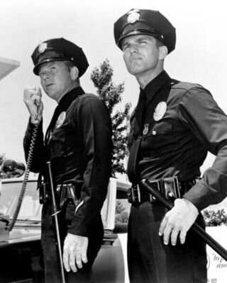 Adam 12 Martin Milner on police radio Kent McCord holds nightstick ...