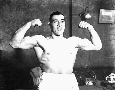 The Italian boxer Primo Carnera flexes his muscles 1920s Old Photo | eBay