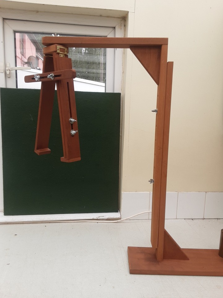 Repairers cuckoo clock stand for final adjustments testing time chimes ...