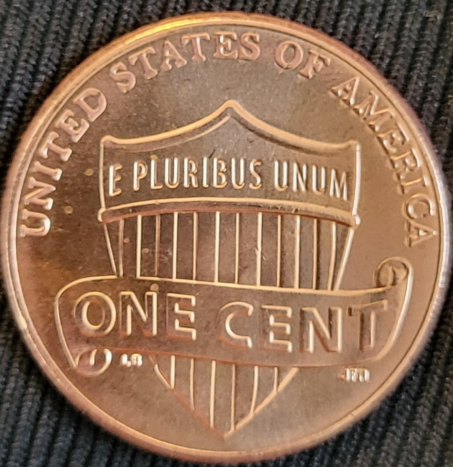 2024 penny spike through back to front of face, faint spike R, fresh ...