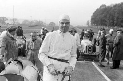 Rudolf Hasse stands next to his Auto Union D on the grid 1938 Racing ...