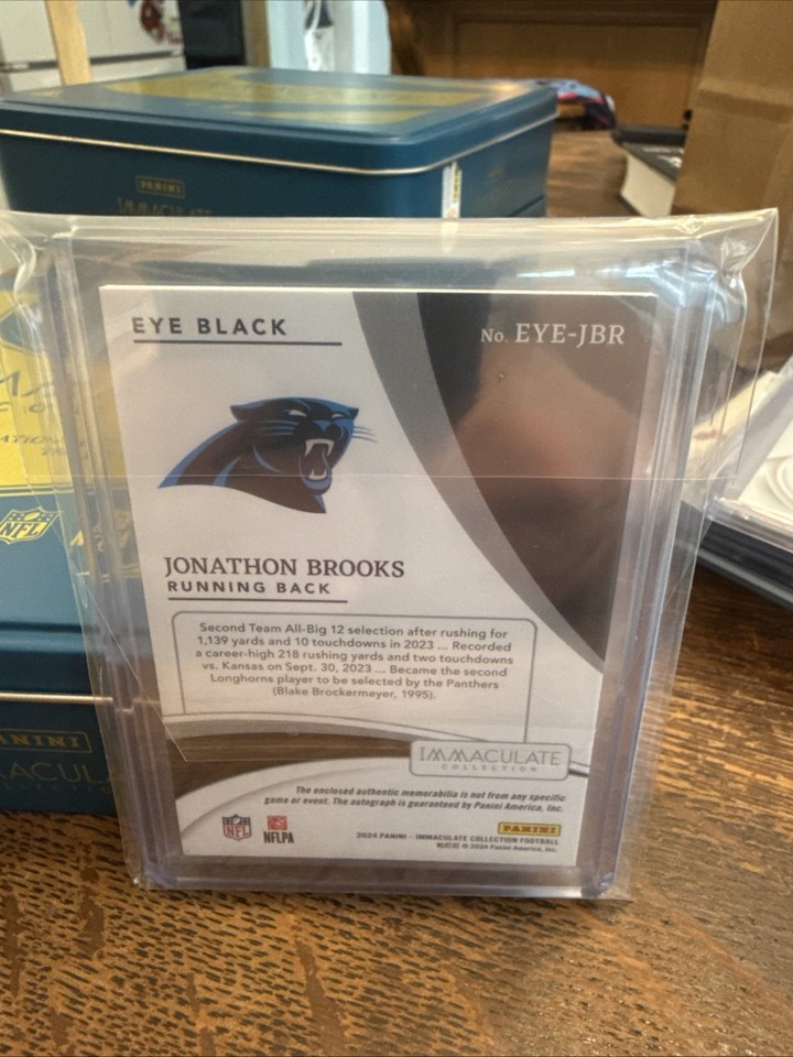 2024 Panini Black -Rookie Signature Materials Jonathon Brooks Eye Black ...