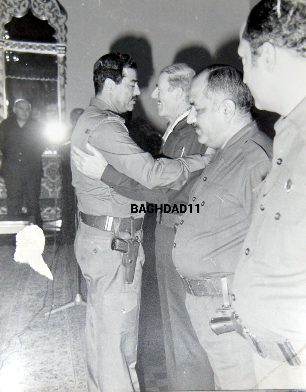 Reprinted photo of Saddam in an official meeting, Iraqi-Irani war era ...