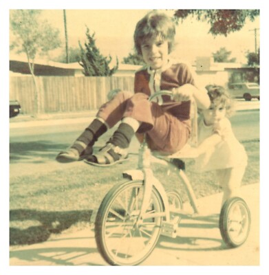 1970s Young Kid Boy Riding Vintage Bicycle with Legs Over Handle Bars ...