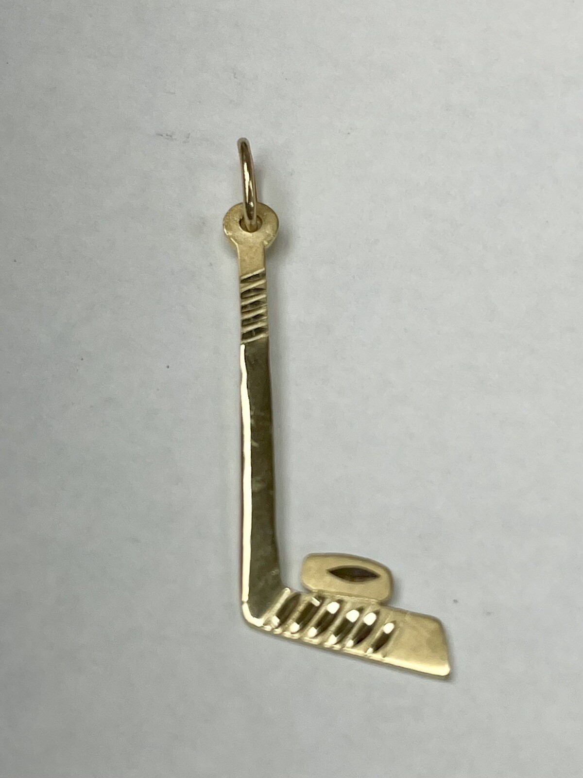 14K Yellow Gold Hockey Stick and Puck Pendant - Gem
