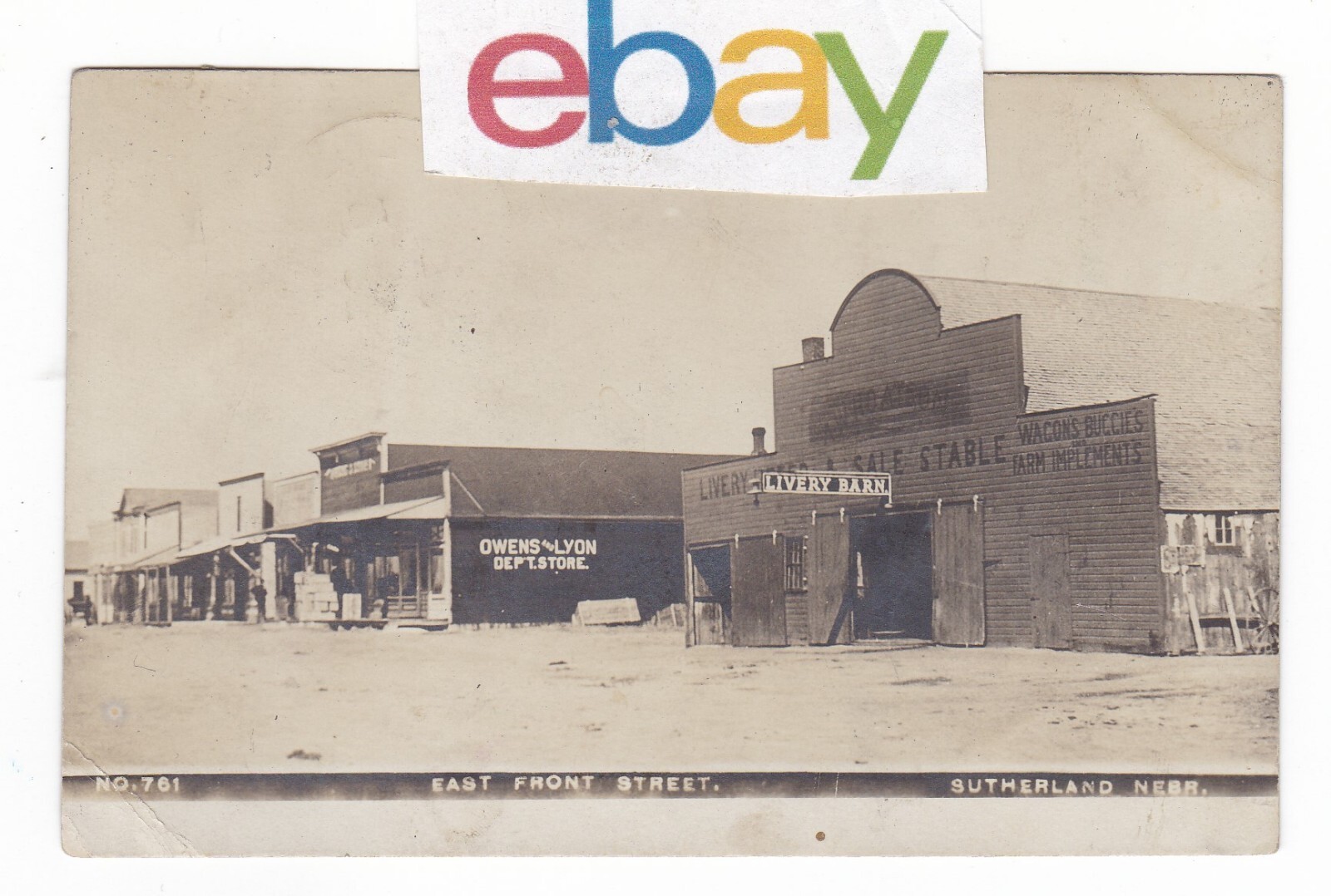 1909 RPPC SUTHERLAND NEBRASKA LIVERY STABLE BARN FARM IMPLEMENTS OLD ...