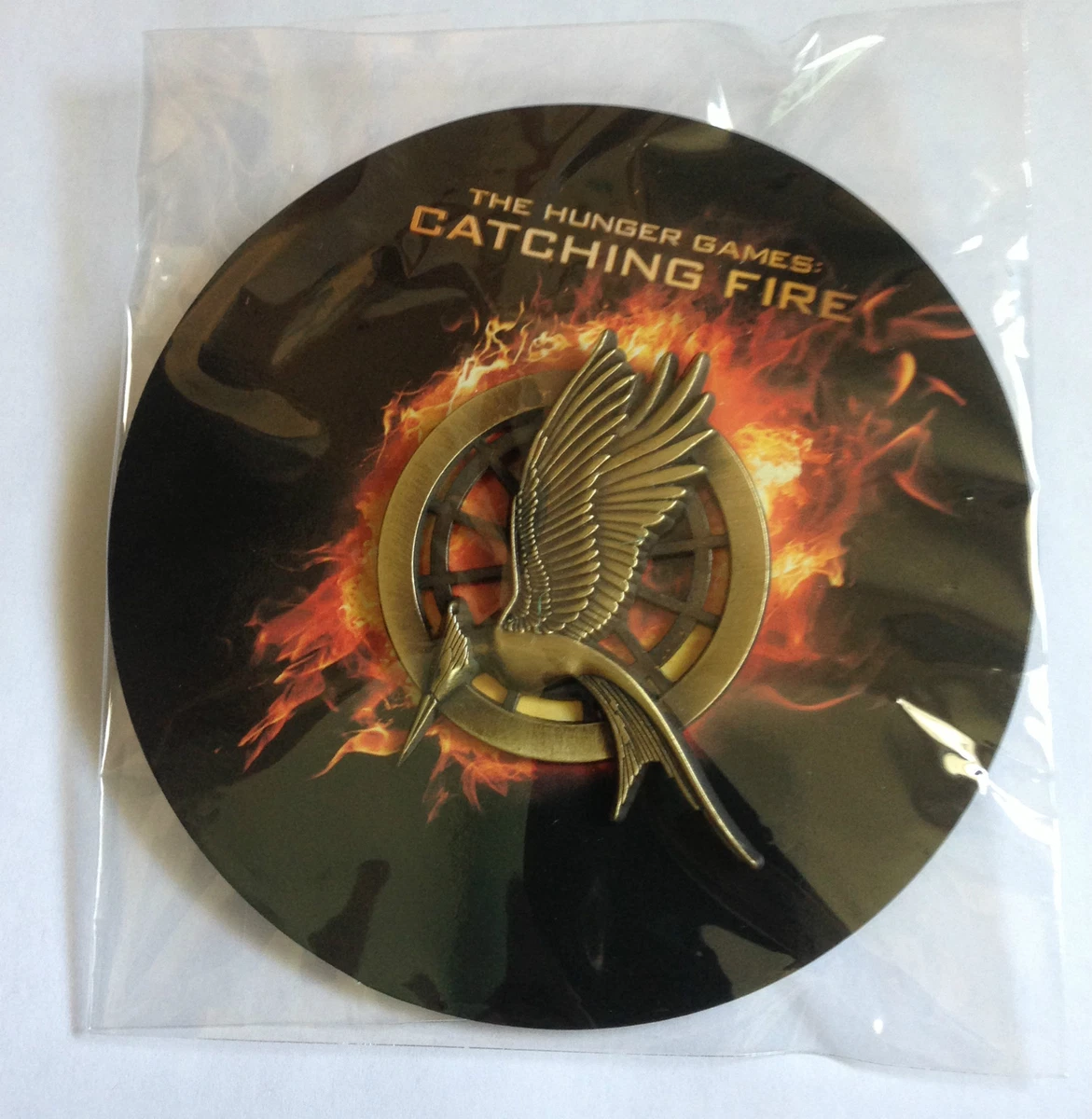 Mockingjay Pin On Fire