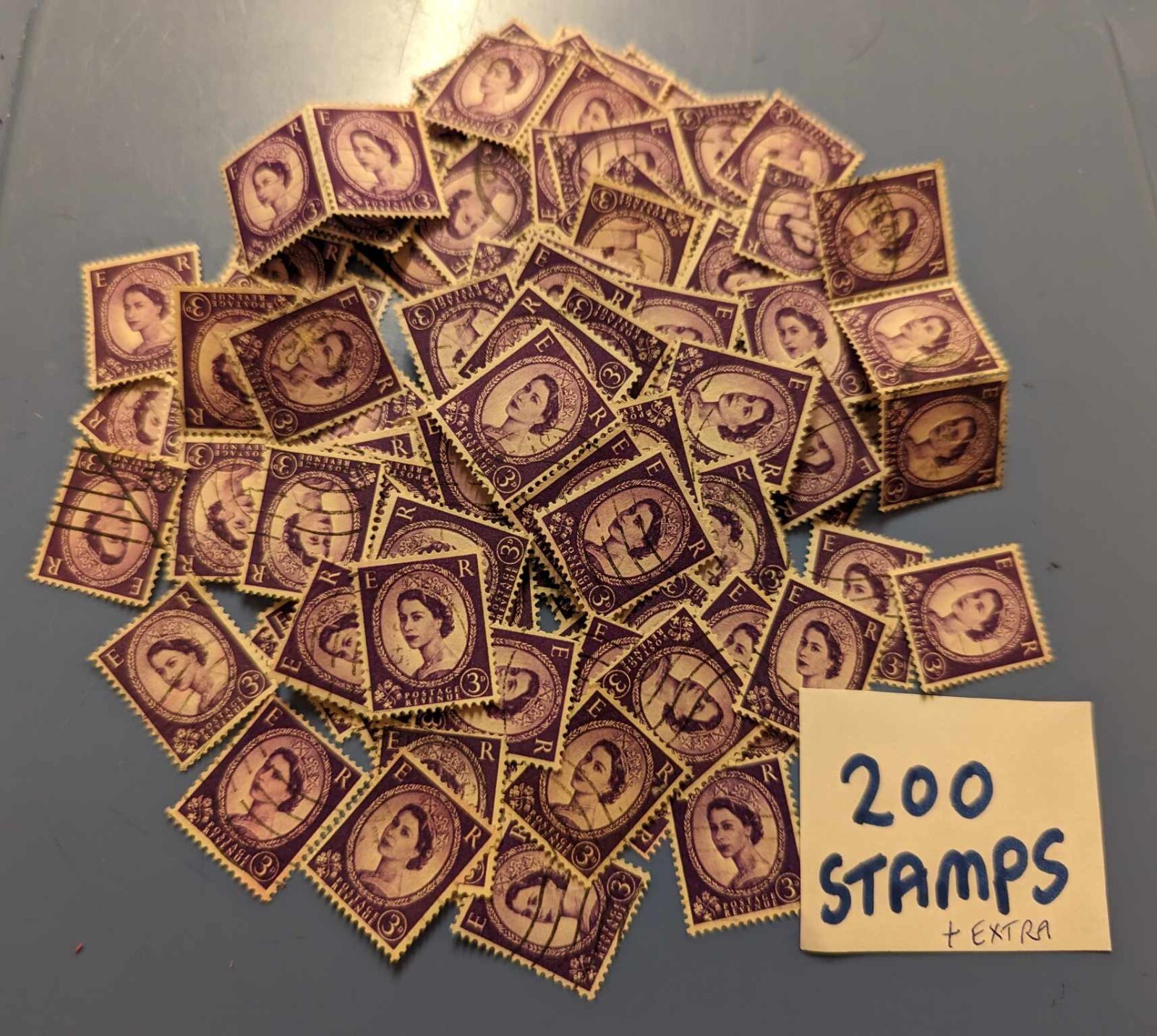 200 Purple old British Queens head / wilding stamps off paper craft ...